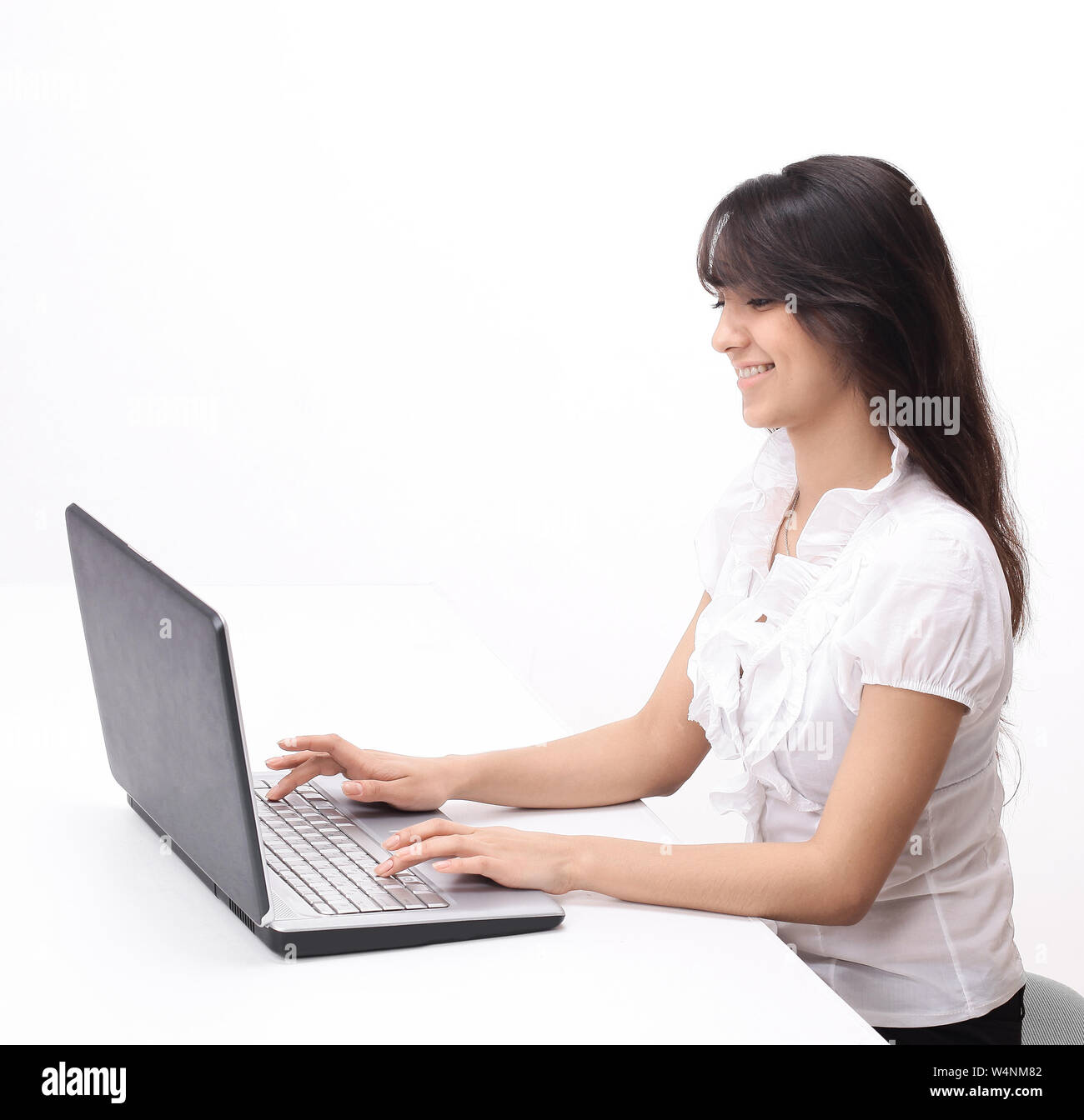 young woman typing text on laptop keyboard.isolated on white background ...