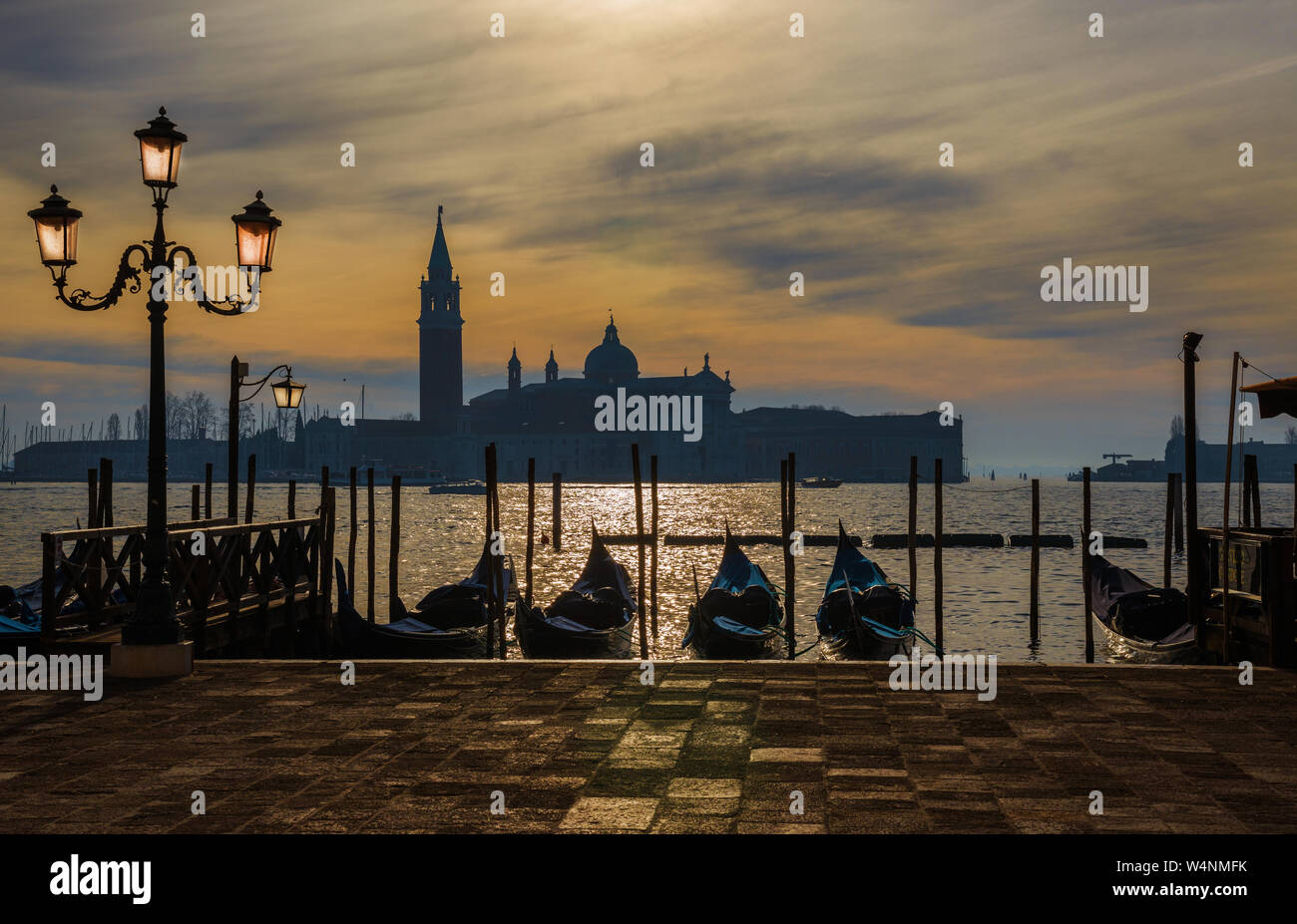 View of winter sunset sky with mist over Saint George Island in Venice ...