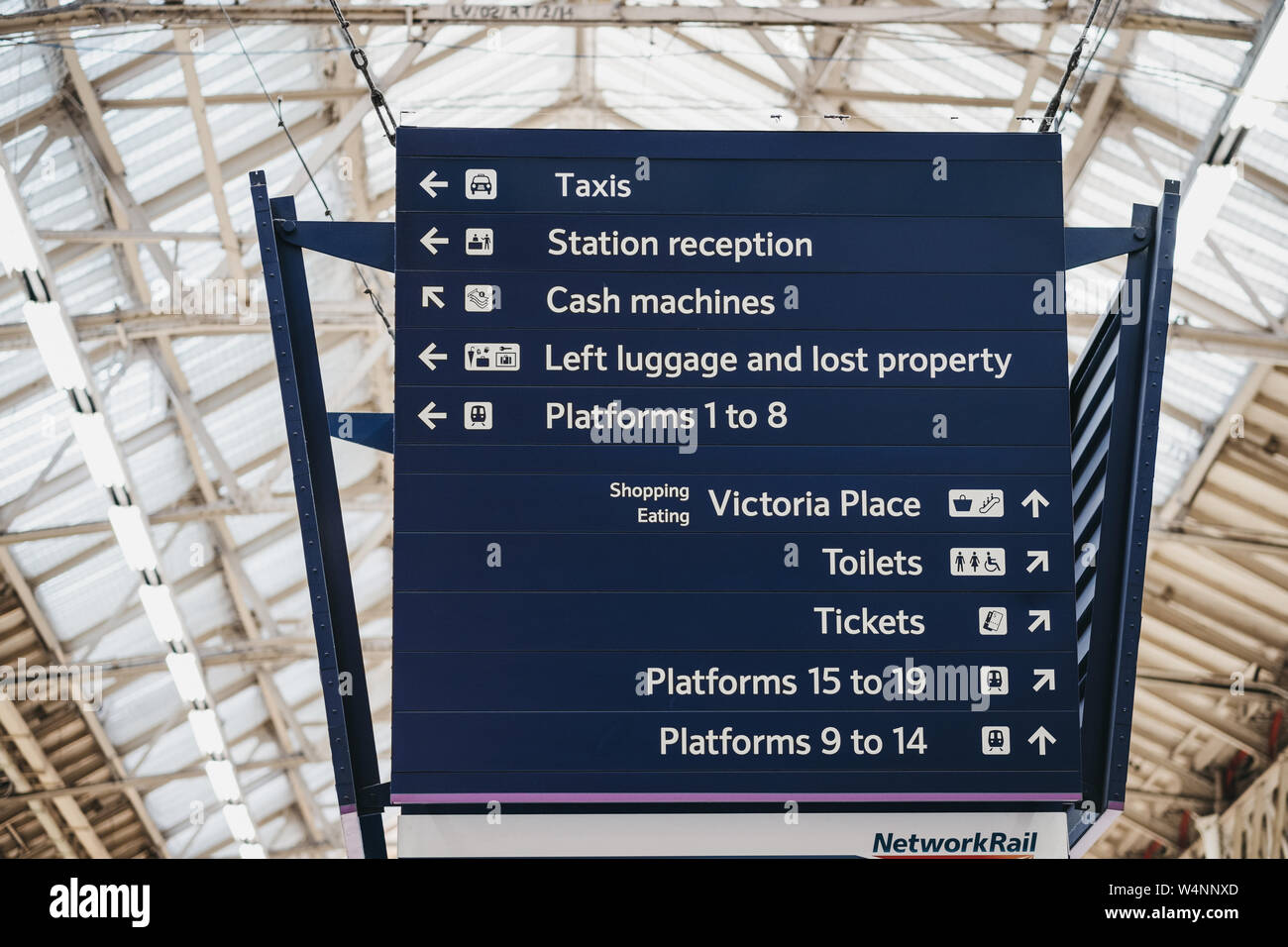 London, UK - July 15, 2019: Low angle view of the directional sign ...