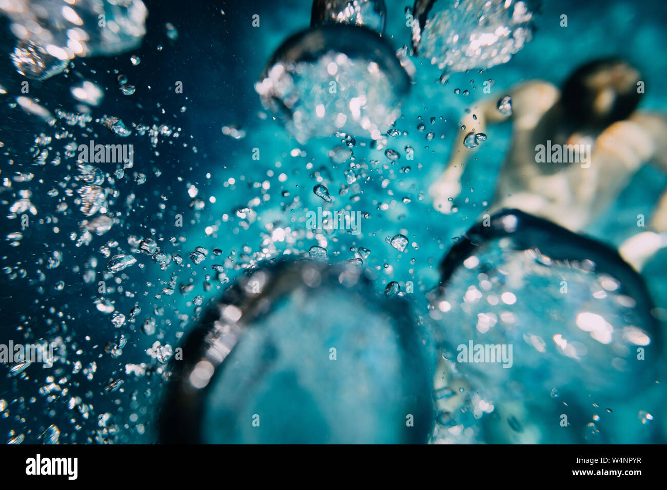 Small bubbles towards the blue surface Stock Photo - Alamy
