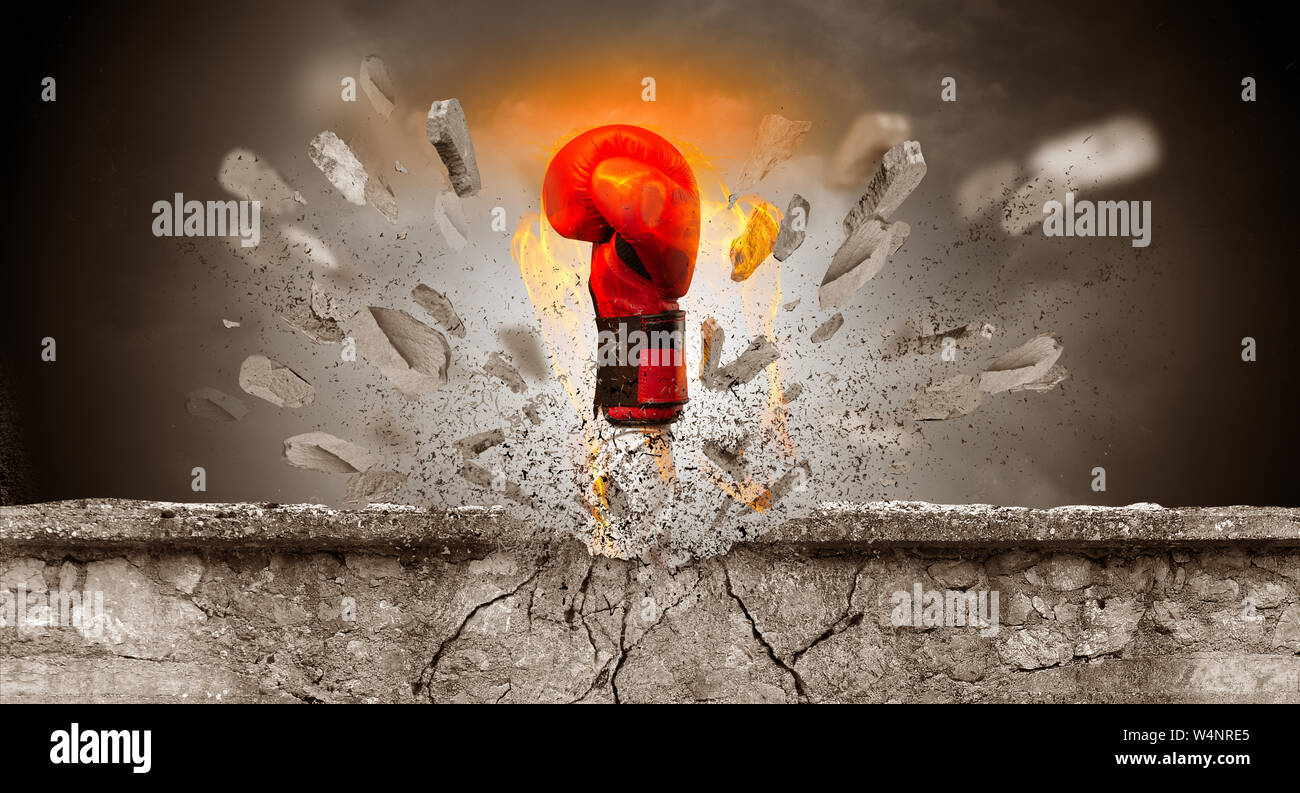 Big hand hits intense and breaks a crass stonewall Stock Photo - Alamy