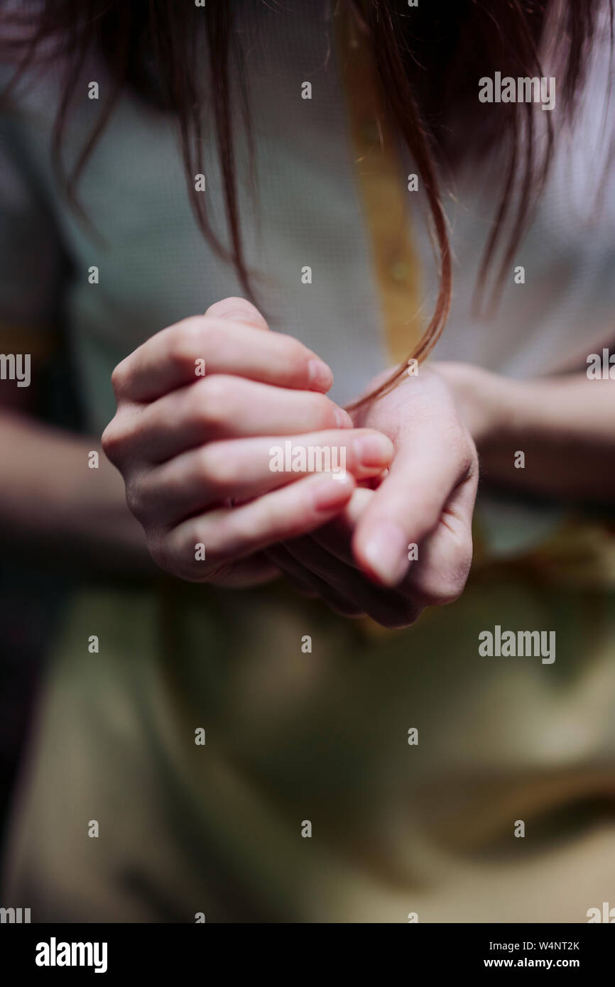 Woman's hands clamped Stock Photo - Alamy