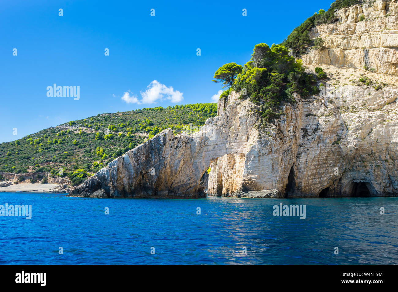 Greece, Zakynthos, Green mountains, white chalk cliffs and blue water ...