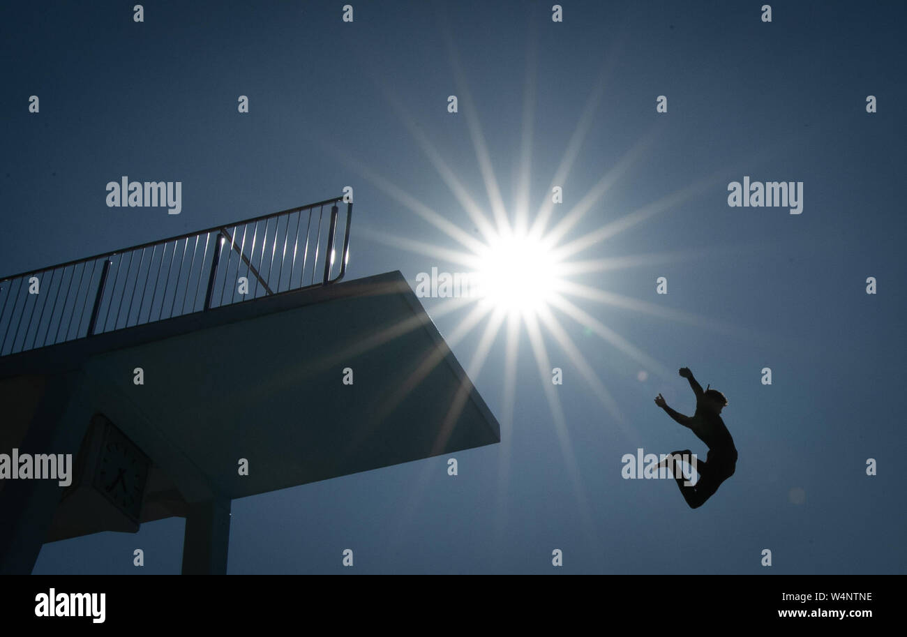 Bielefeld, Germany. 24th July, 2019. A swimmer jumps from the 10-metre ...