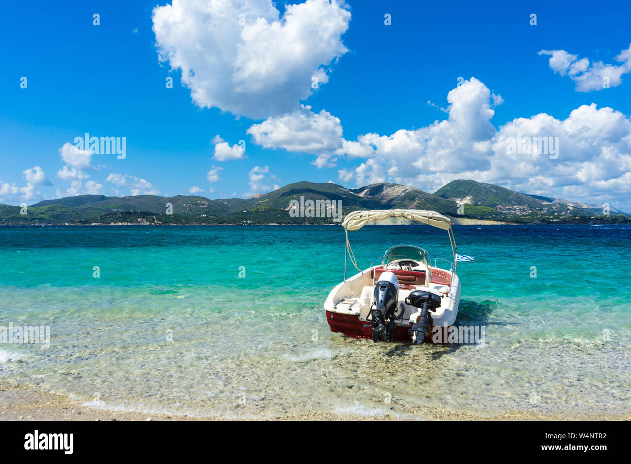 Red speed boat waiting for race at perfect azure blue sand beach Stock ...
