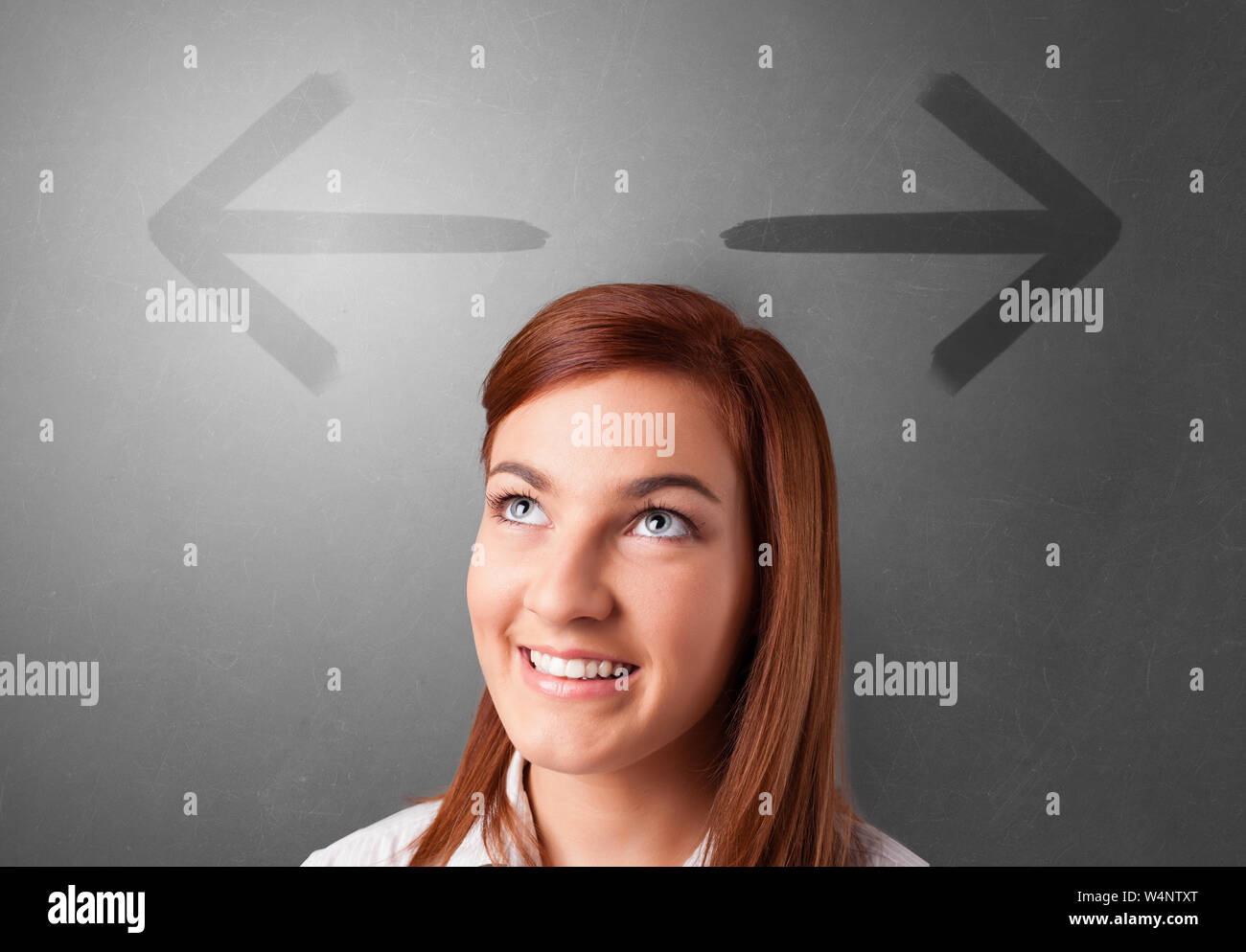 Business person choosing between two directions Stock Photo - Alamy