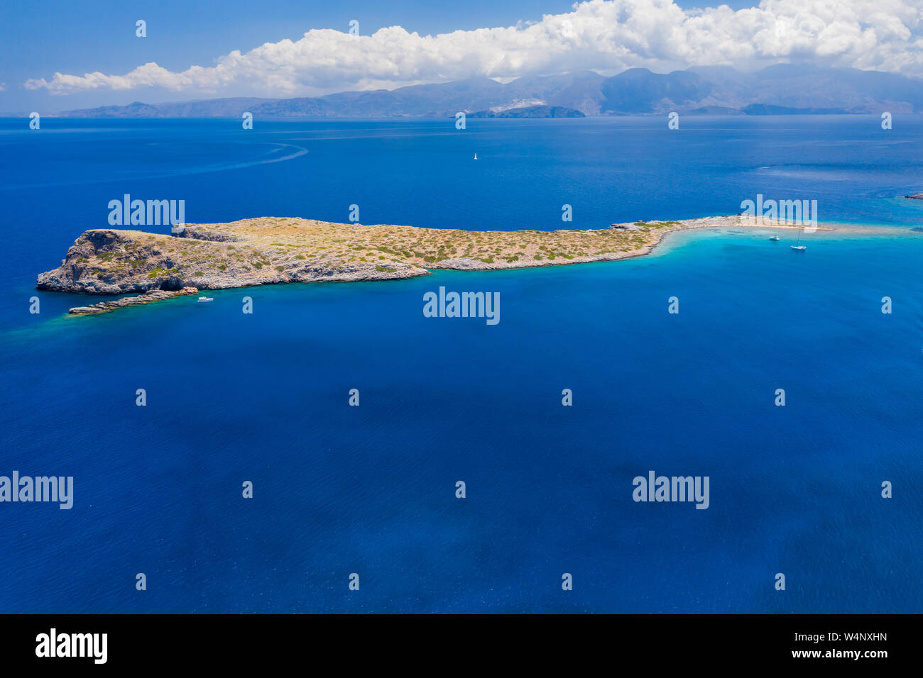 Aerial drone view of the dry summer coastline and crystal clear waters ...