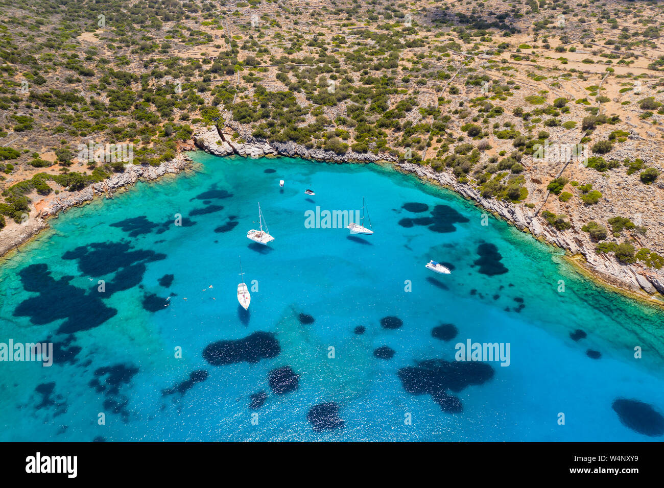Aerial drone view of traditional Greek wooden boats floating on the ...