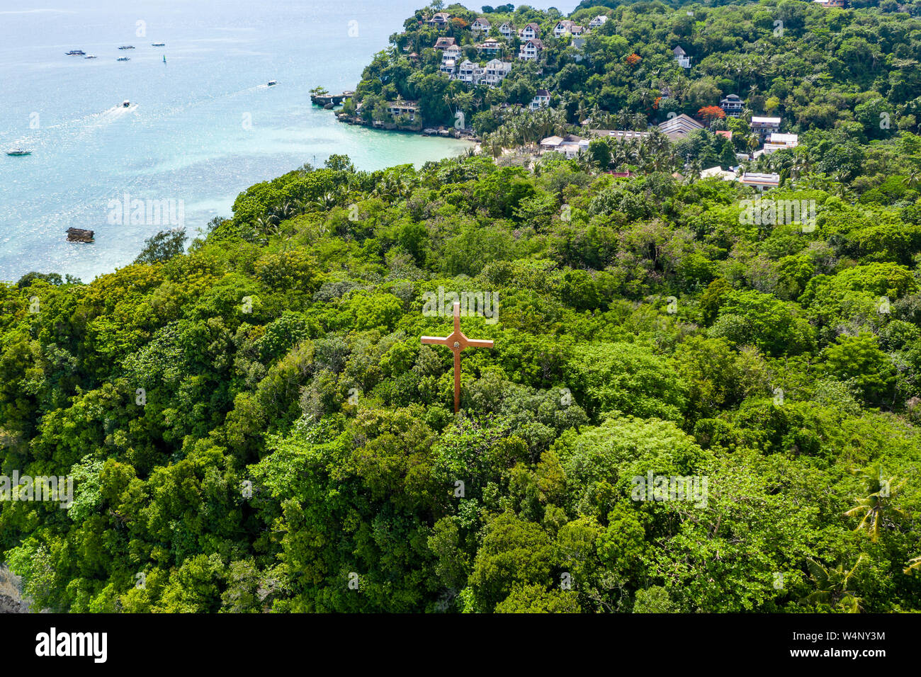 Aerial view of a large cross on top of a cliff above Boracay island's ...