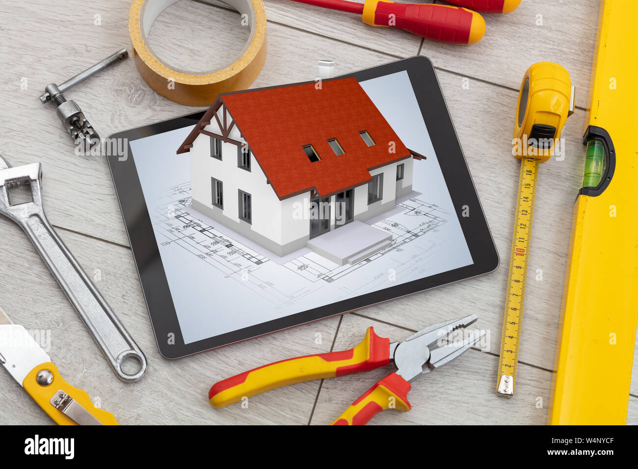 Tablet with construction tools and 3d home plan concept Stock Photo - Alamy