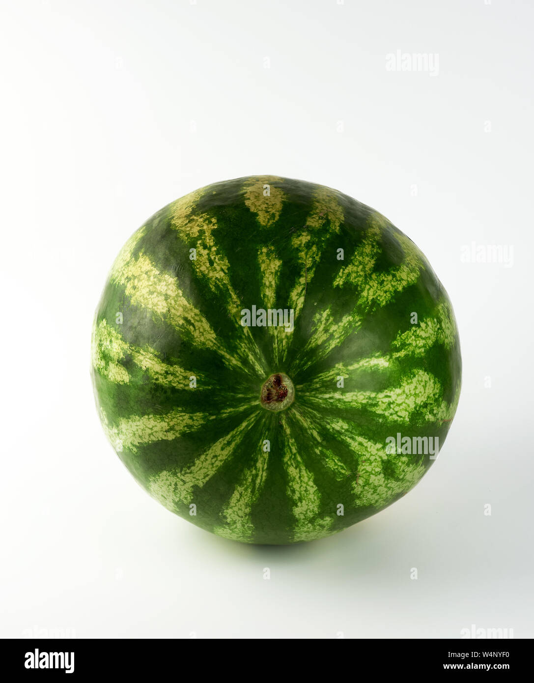 big green striped whole watermelon on a white background, summer berry ...