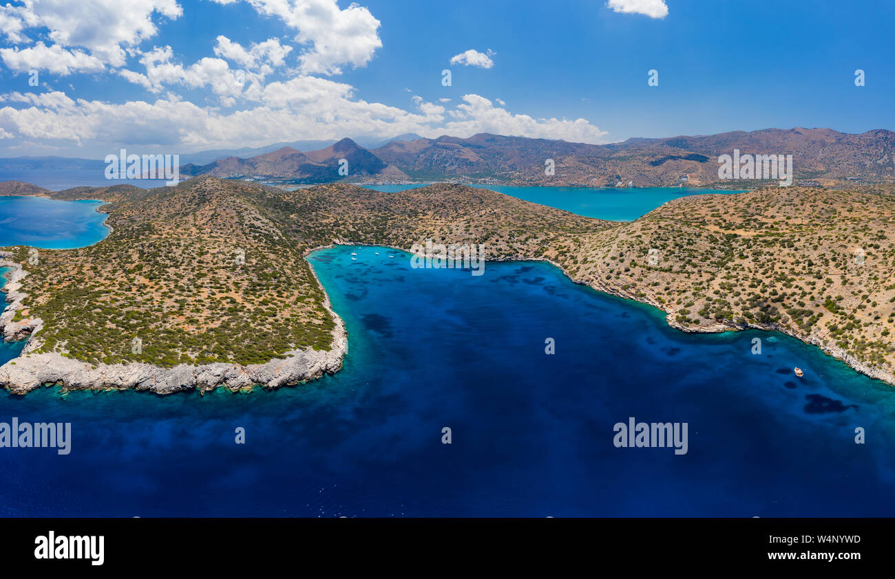 Aerial drone view of the dry summer coastline and crystal clear waters ...