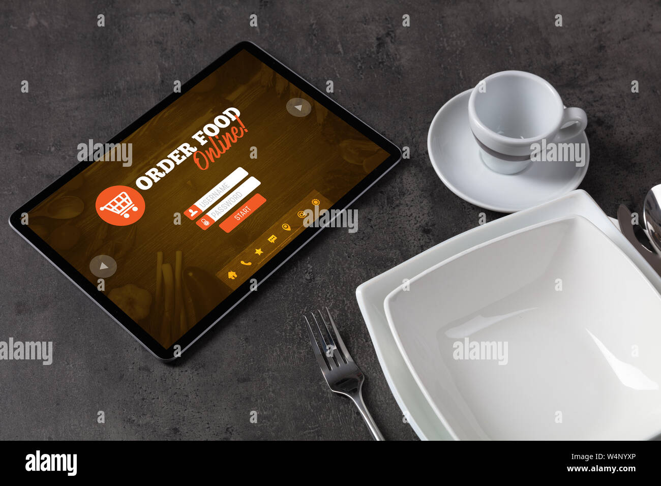 Tablet with online order concept on a lain table Stock Photo - Alamy