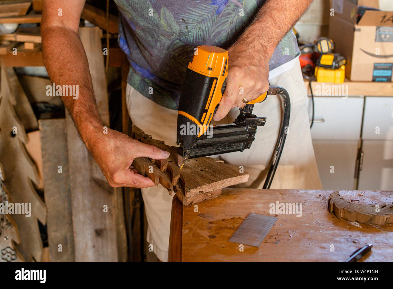 Above view of a men using a hand drill in his woodworking shop Stock ...