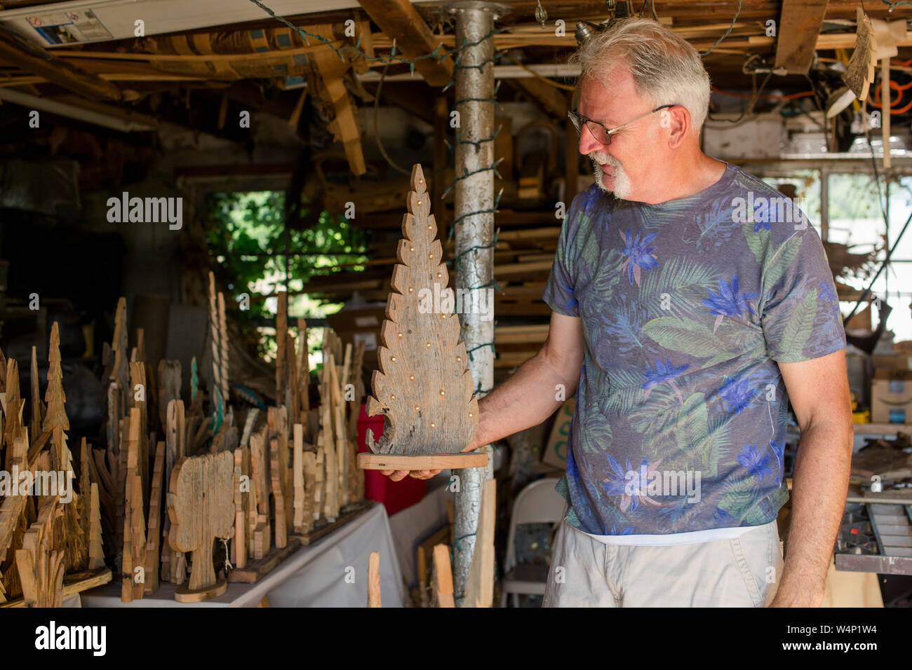 A proud craftsman displays his work in a workshop Stock Photo - Alamy