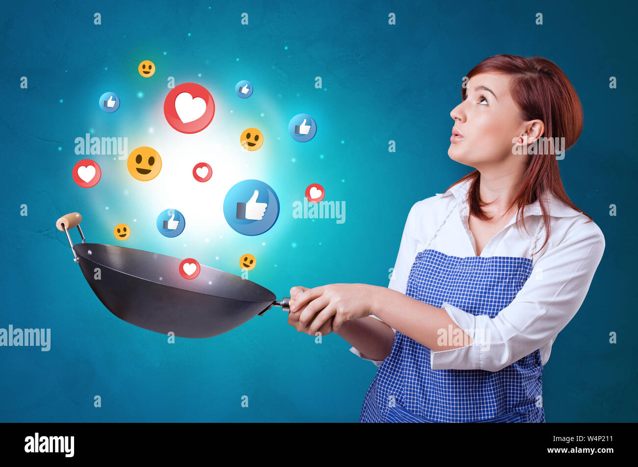 Young happy person cooking social media concept in wok Stock Photo - Alamy