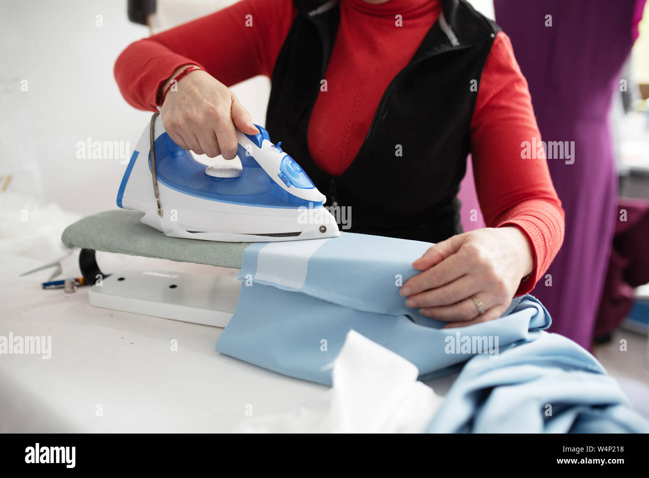 Ironing fashion design studio hi-res stock photography and images - Alamy