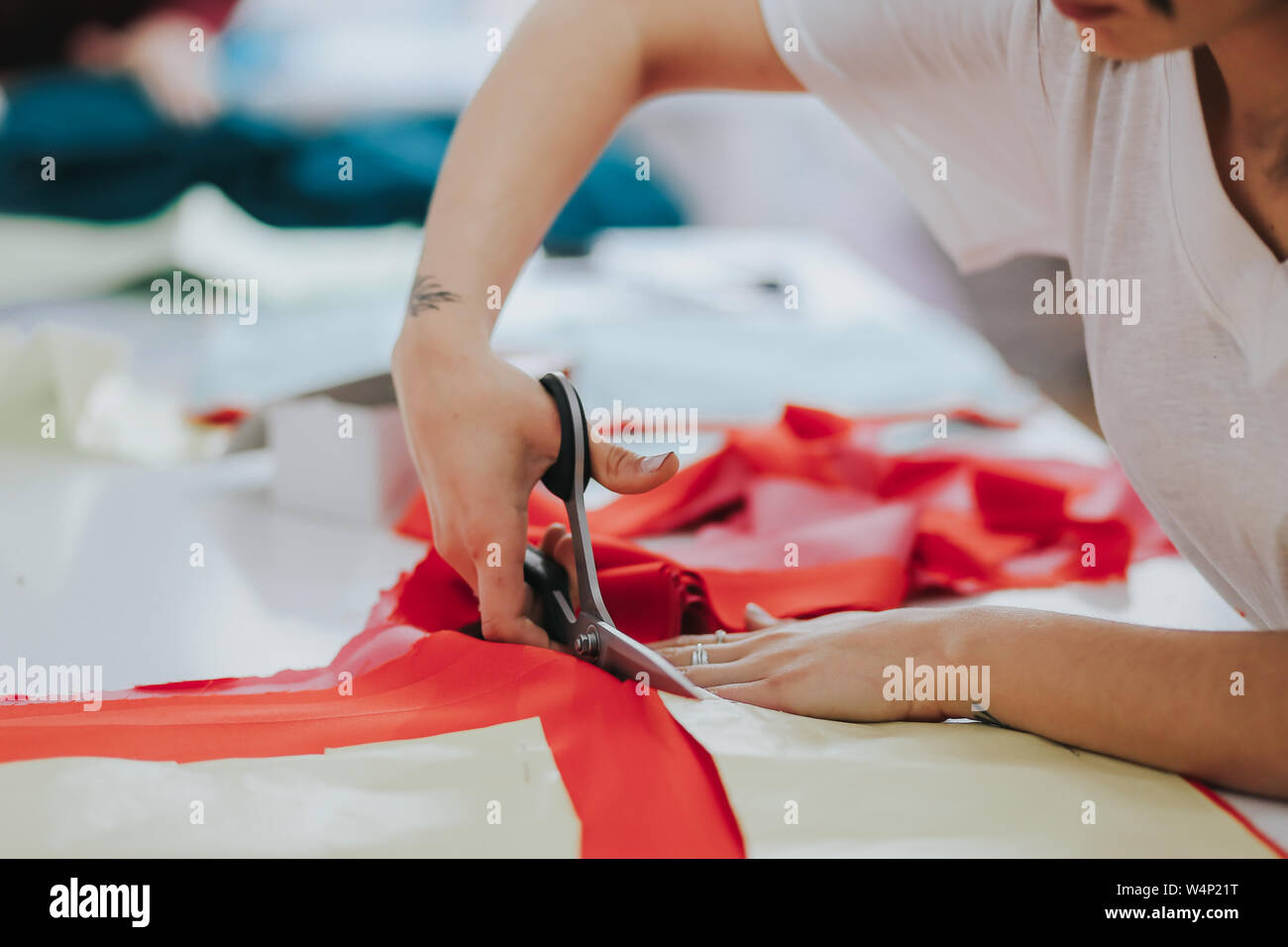 Woman cutting a sewing pattern hi-res stock photography and images - Alamy