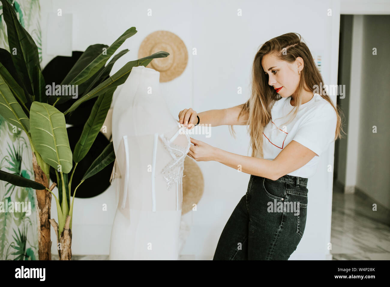fashion designer making a wedding dress Stock Photo - Alamy