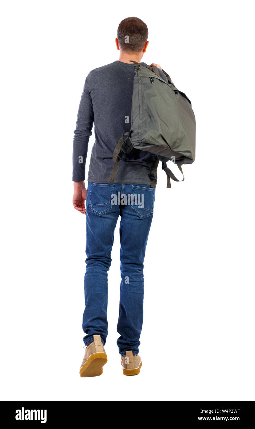 back view of walking man with green bag. backside view of person ...