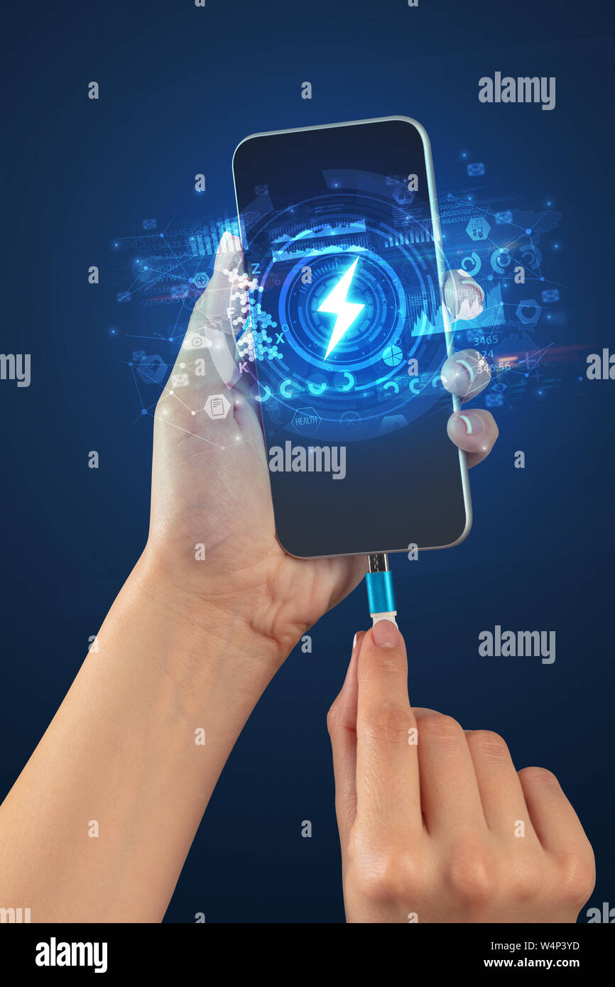 Elegant hand charging smartphone with global report concept Stock Photo ...