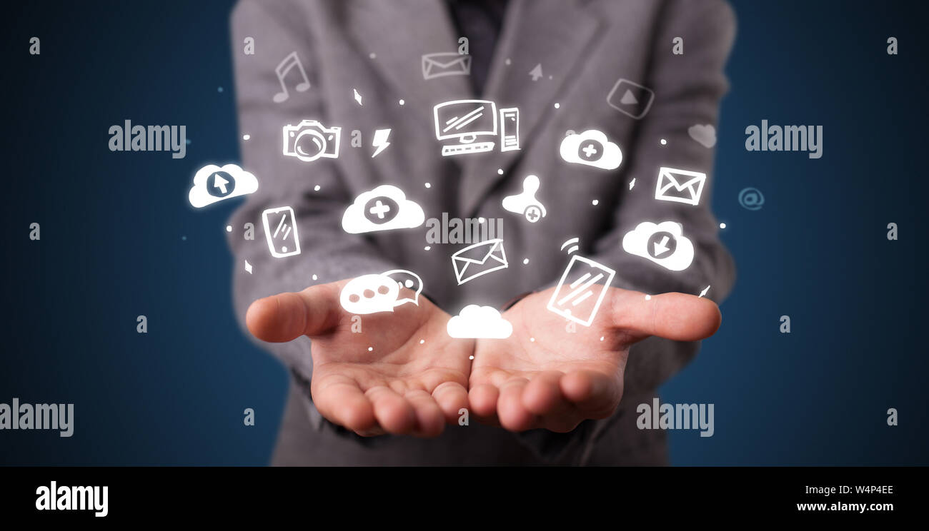 Hand holding application icons and symbols in her hand Stock Photo - Alamy