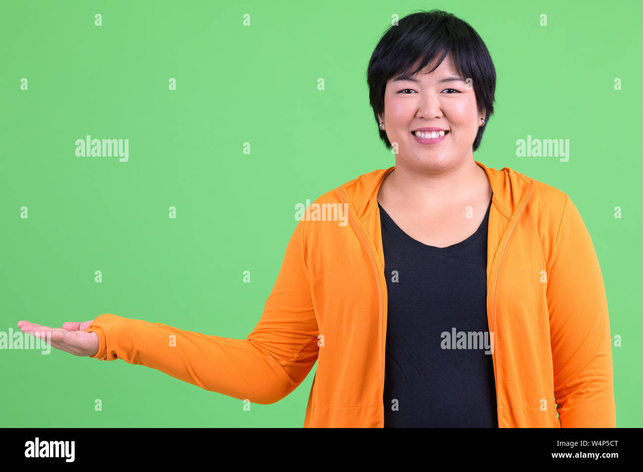 Happy overweight asian woman showing hi-res stock photography and ...