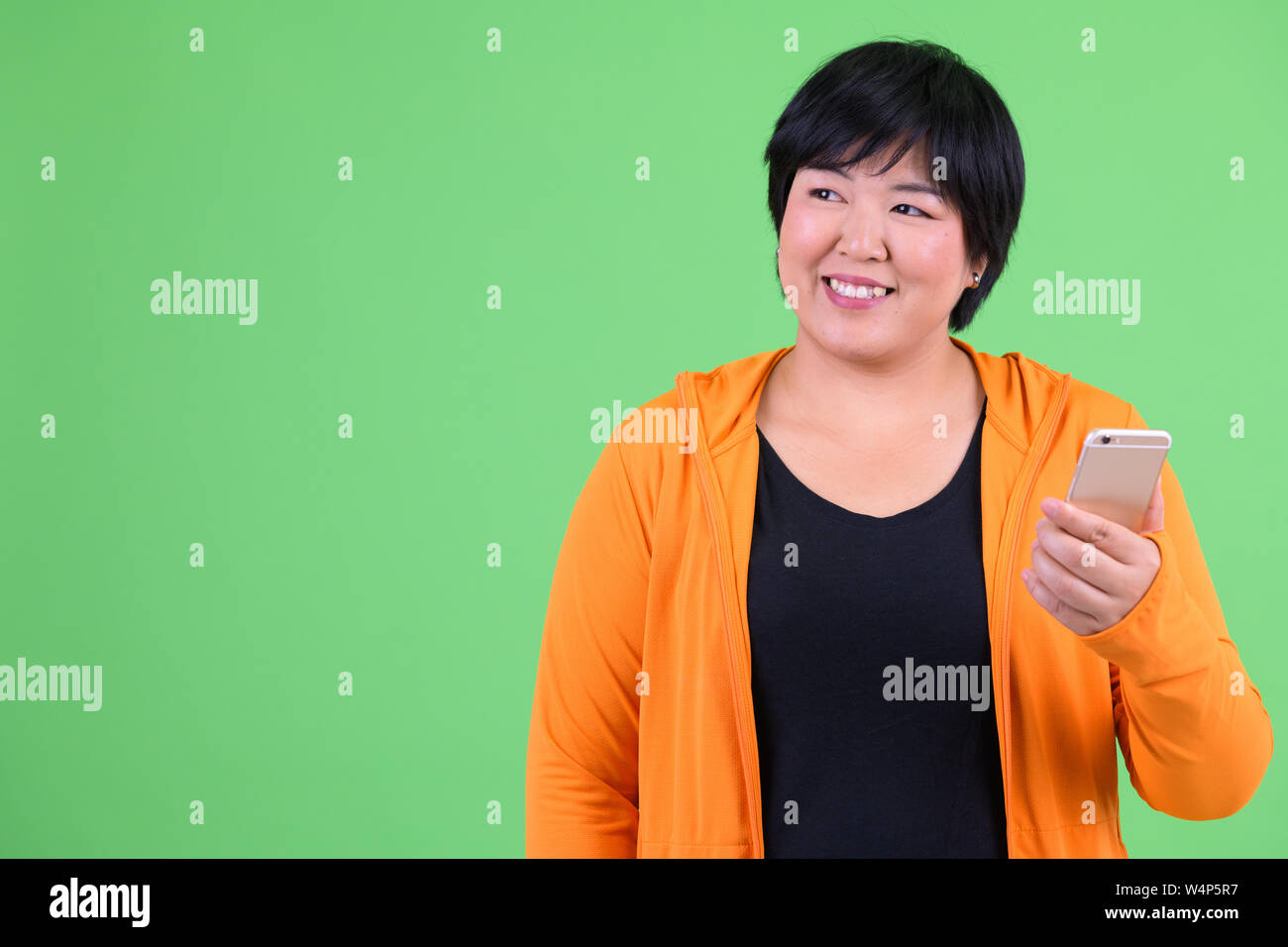 Happy overweight asian woman thinking hi-res stock photography and ...