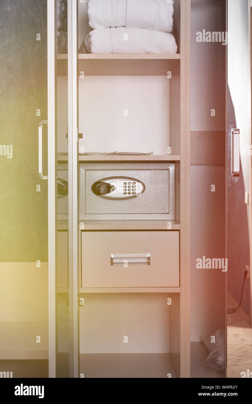 A wardrobe in the hotel room and a safe, bedroom interior Stock Photo ...