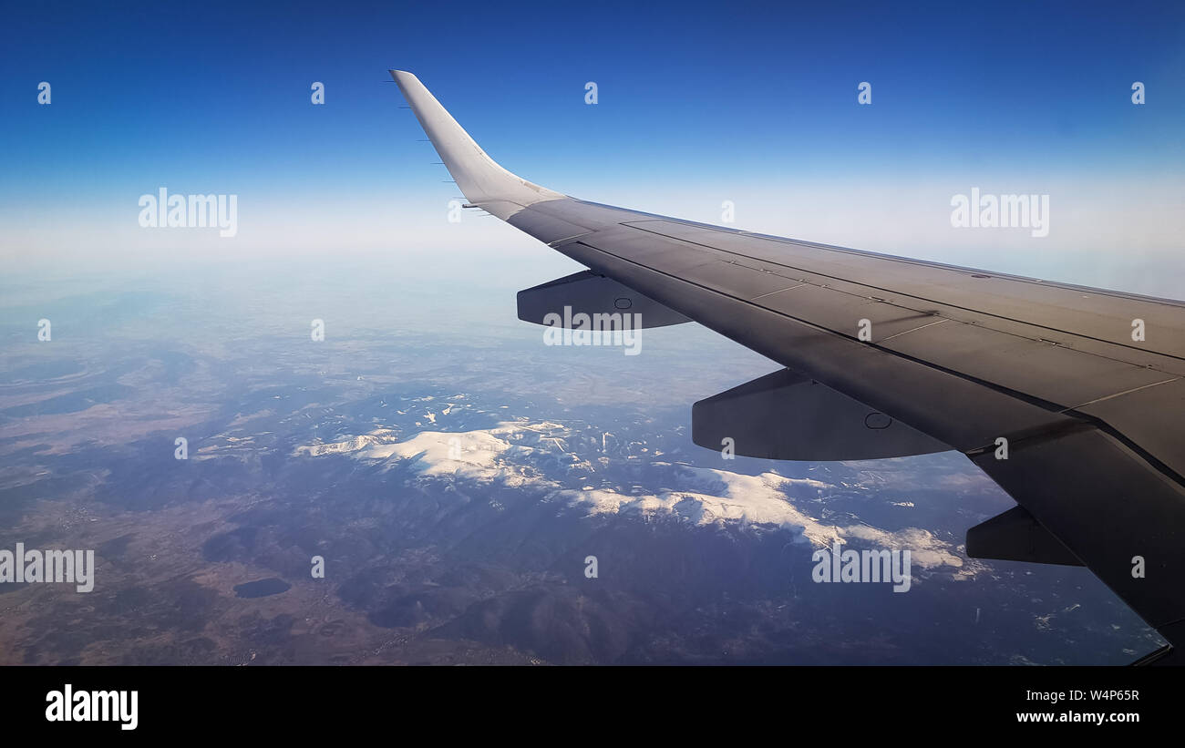 Aerial view from aircraft window with clouds Stock Photo - Alamy
