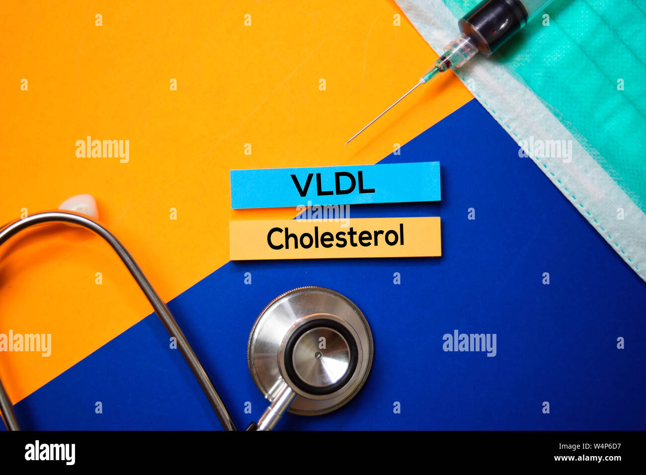 VLDL Cholesterol text on Sticky Notes. Top view isolated on color ...