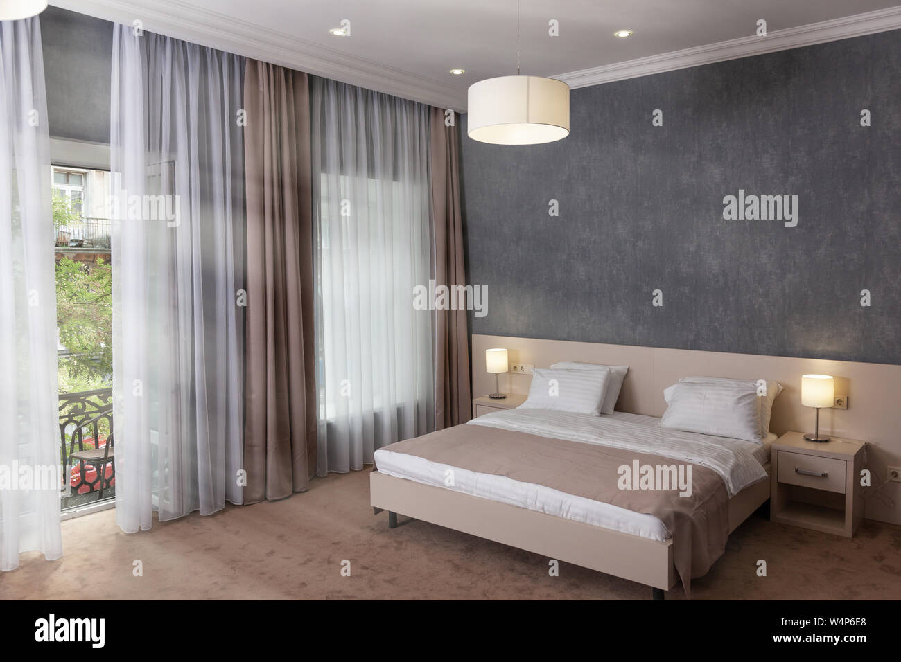 Interior of a cozy hotel room, bedroom Stock Photo - Alamy