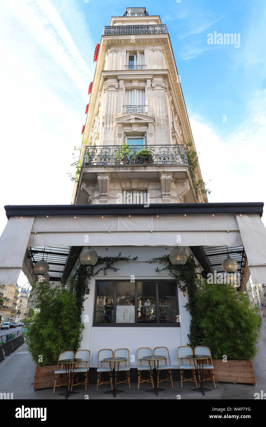 Typical view of the Parisian street with tables of cafe in Paris ...
