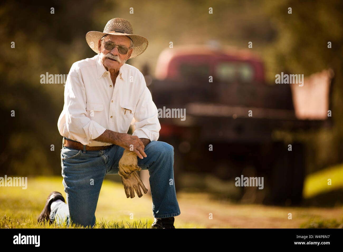 Farmer kneels hi-res stock photography and images - Alamy