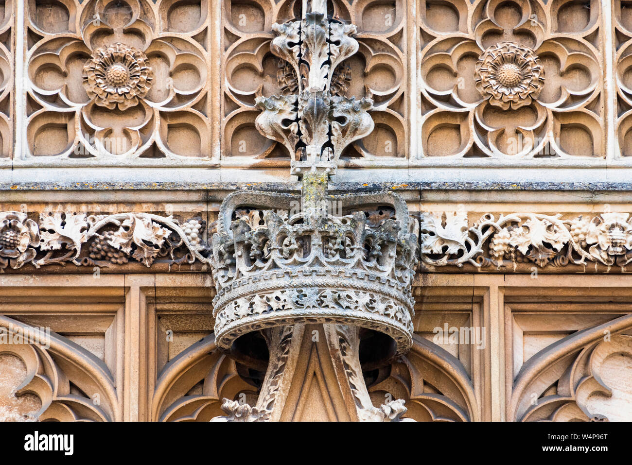 UK, Cambridge - August 2018: Crown carved into the stone facade of the ...