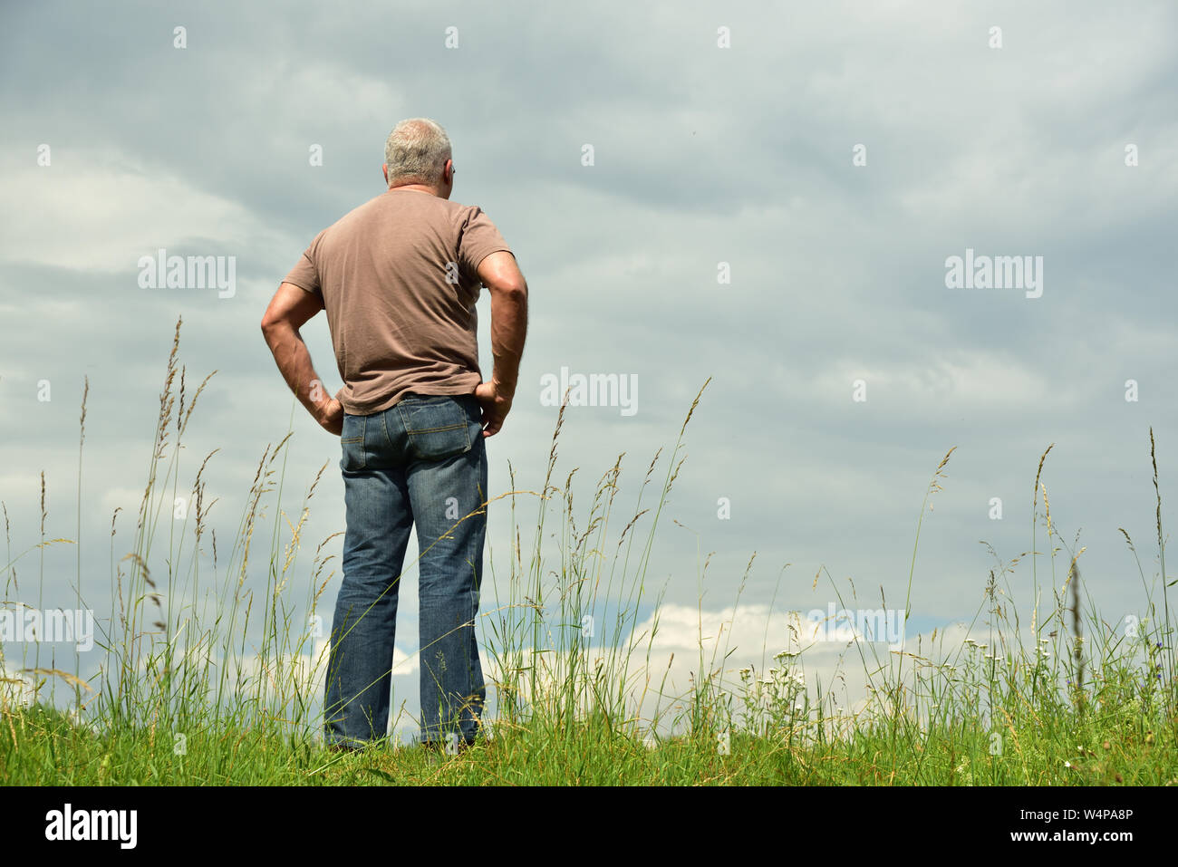 Cloudy sky man hi-res stock photography and images - Alamy