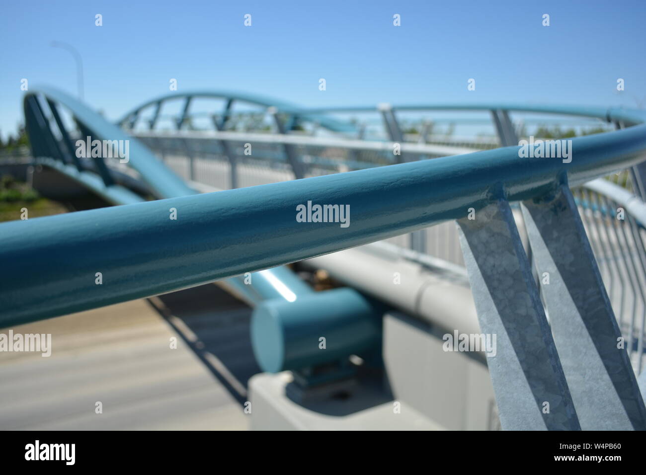 Handrail of pedestrian bridge over highway Stock Photo - Alamy