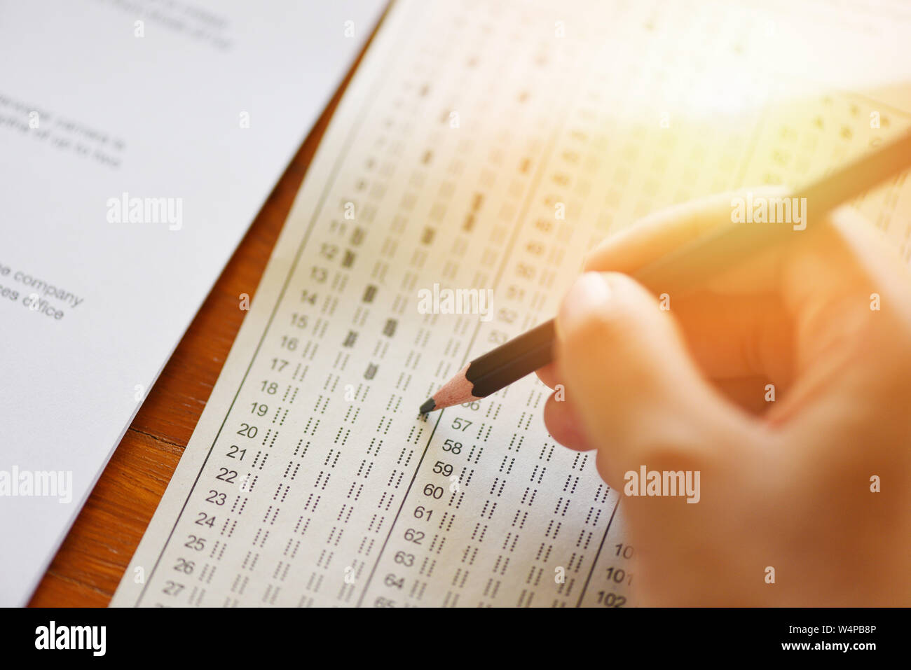 take the exam final high school hand student holding pencil writing on ...