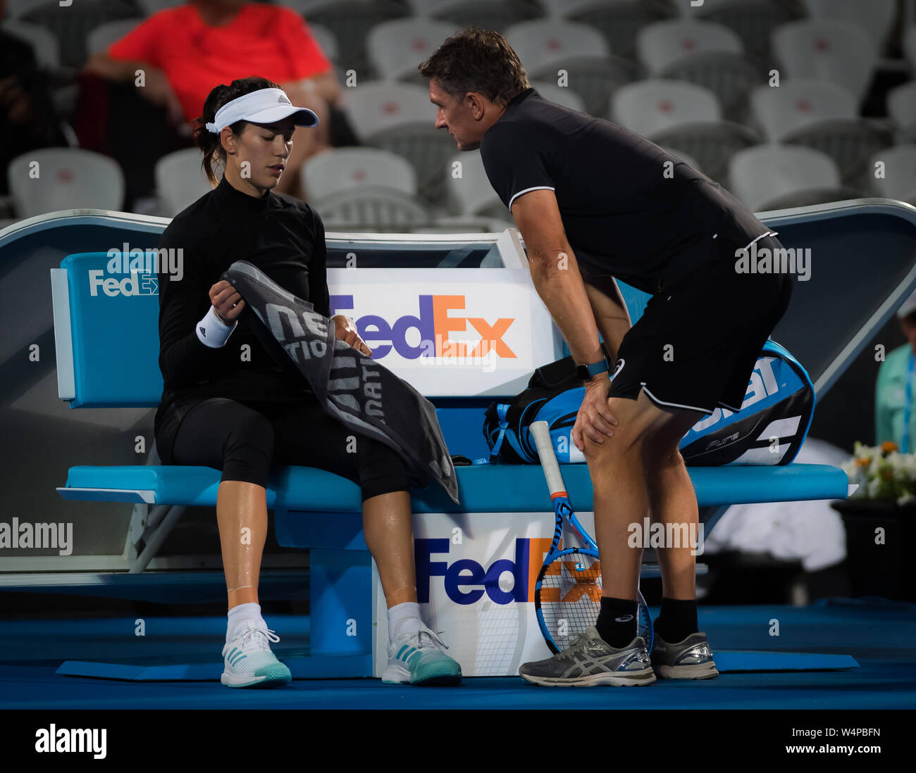 Garbine Muguruza of Spain listens to coach Sam Sumyk during her first ...