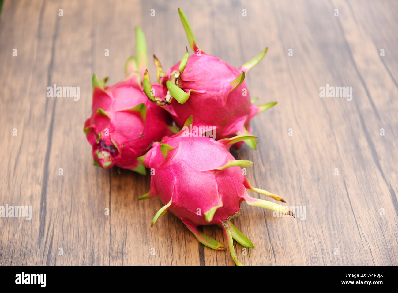 Dragon fruit on wooden nature green background / Fresh pitaya summer ...