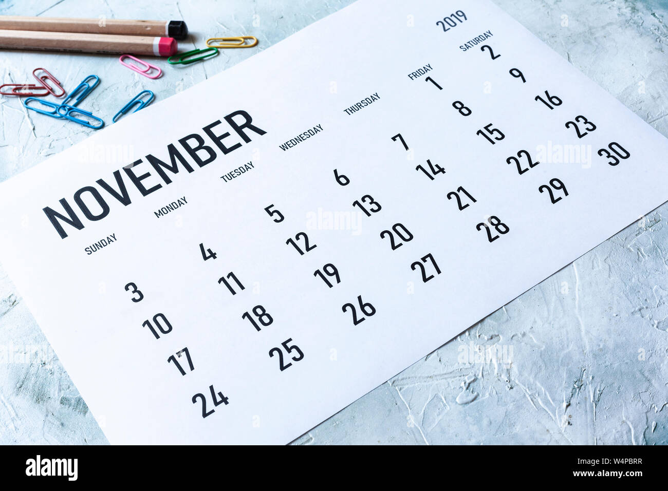 Simple 2019 November monthly calendar on the table with office supplies ...