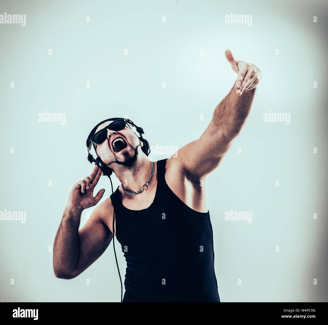 DJ - rapper in headphones takes the rap and break dancing dance on a ...