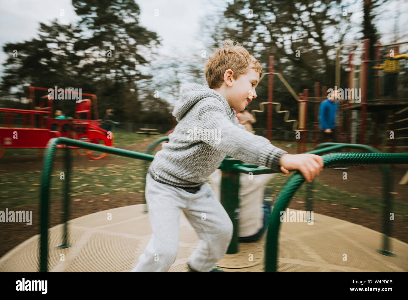 Playground roundabout hi-res stock photography and images - Alamy