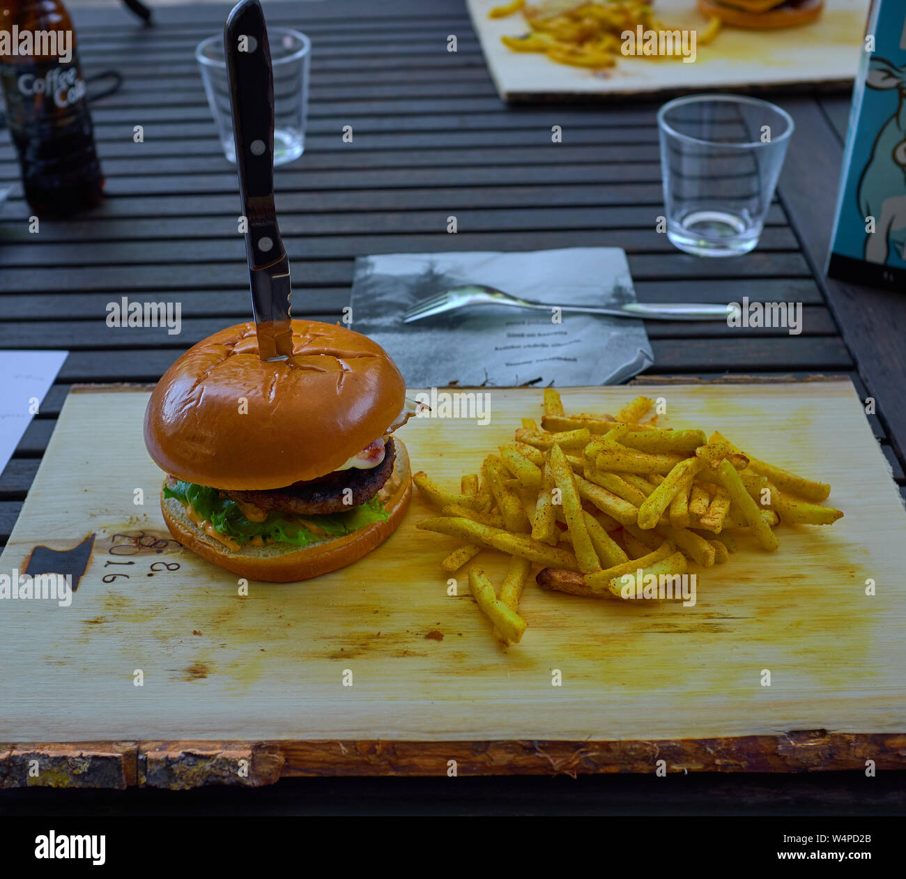 Fast food hamburger and french fries on a old spetial traditional ...