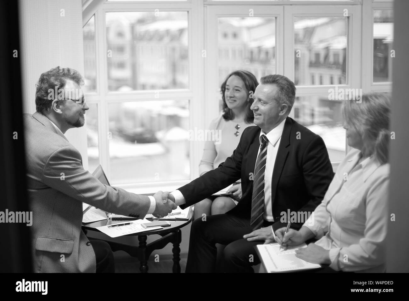 Happy business partners in Black and White Stock Photos & Images - Alamy