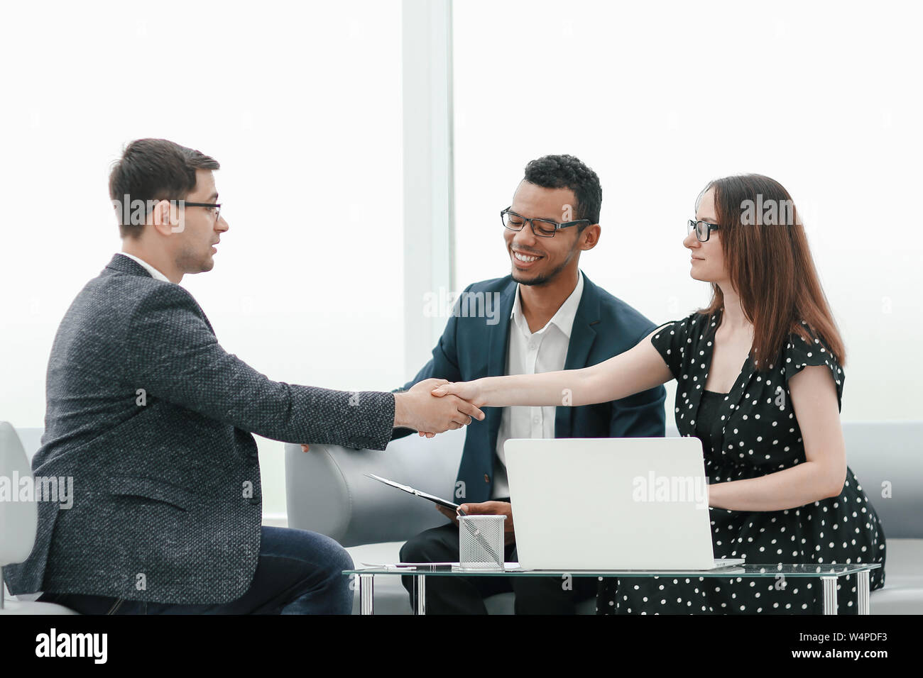 business partners shaking hands over the table negotiation . concept of ...