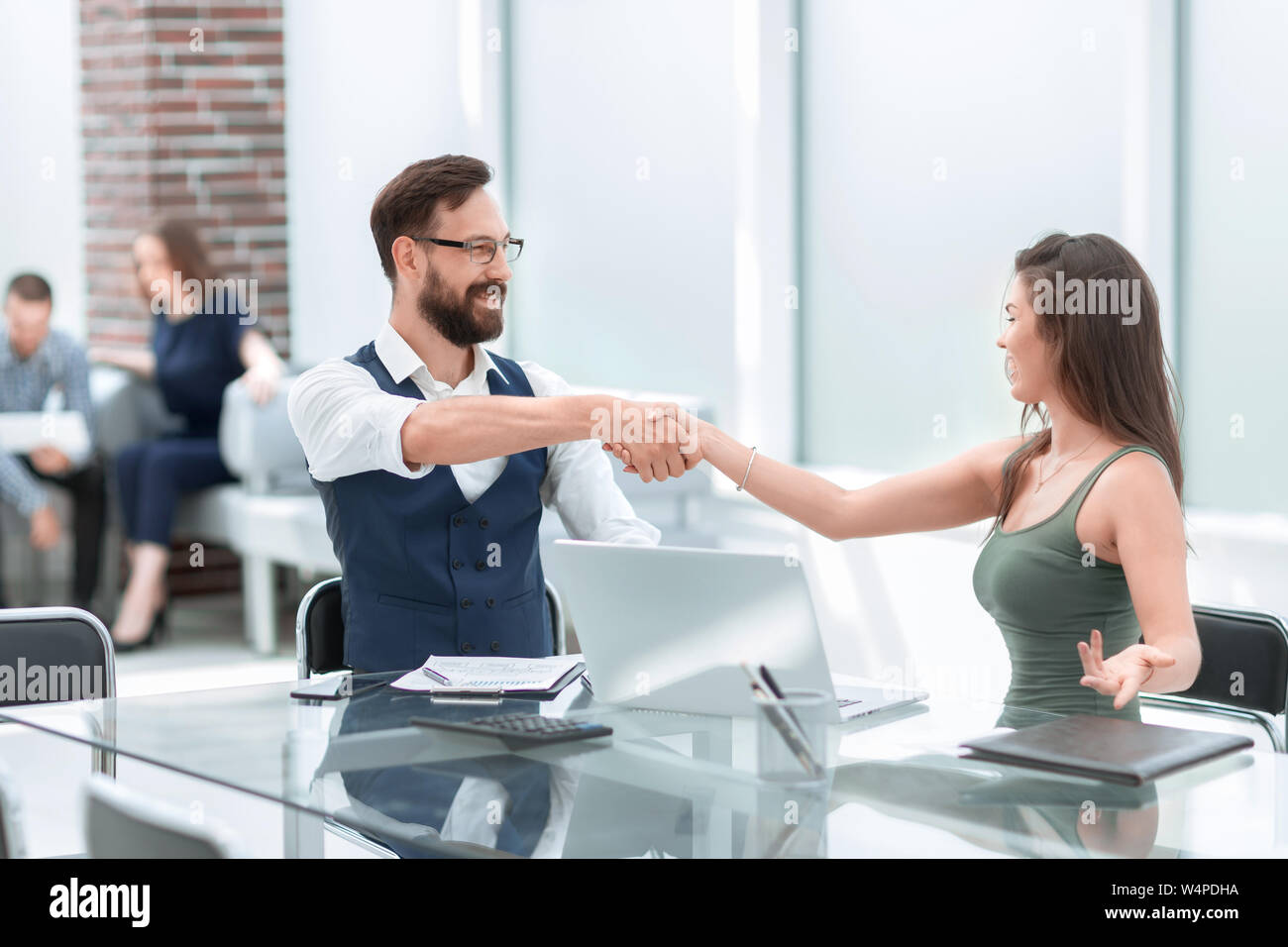 handshake business partners at the office Desk .concept of cooperation Stock Photo - Alamy