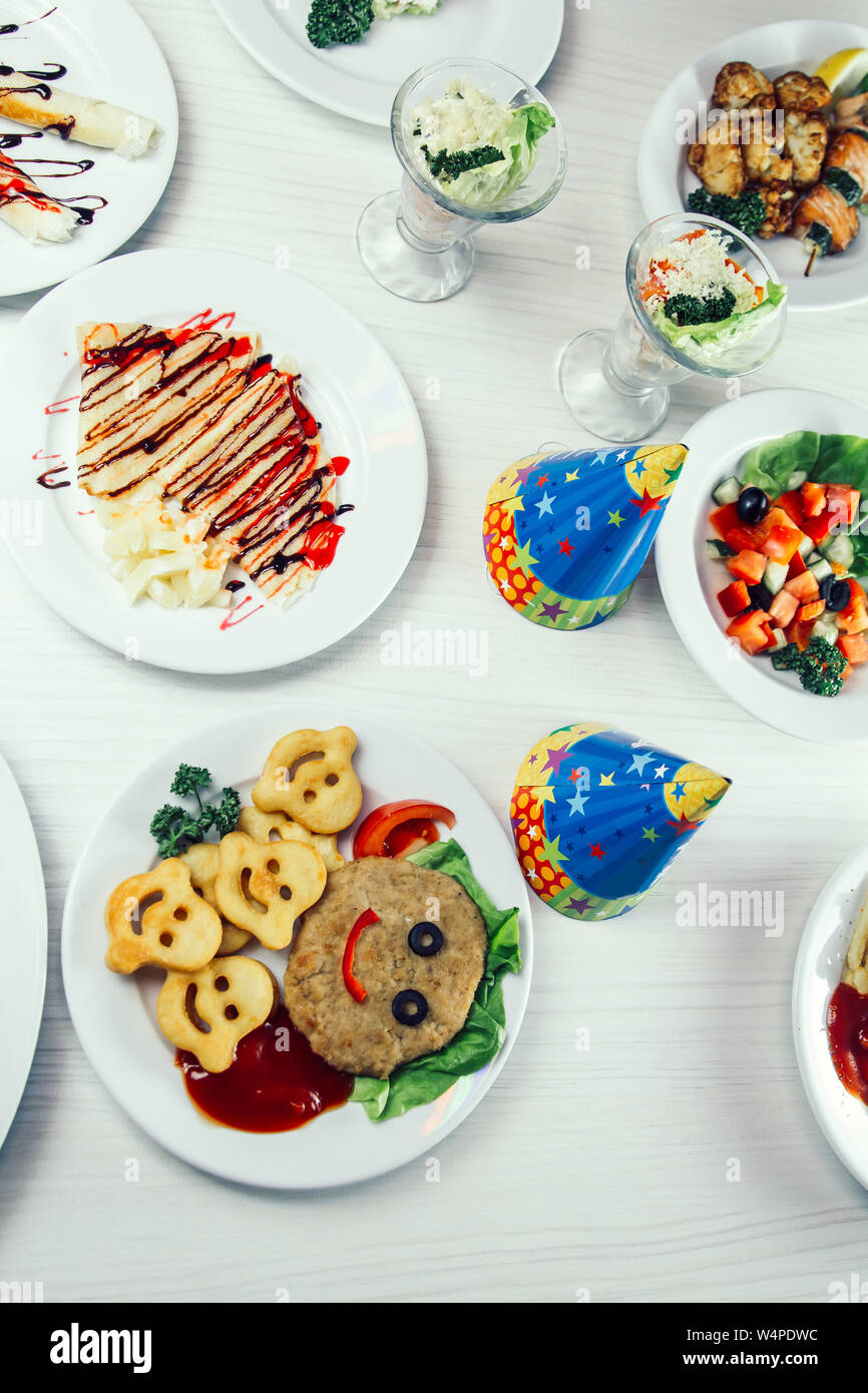 cheerful potato snacks and other festive dishes for children's feast ...