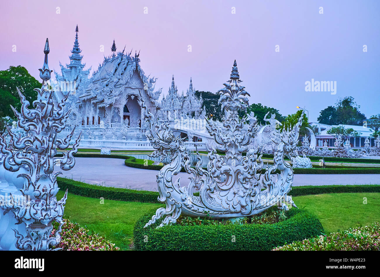 The topiary garden of White Temple is decorated with ornate sculptures ...