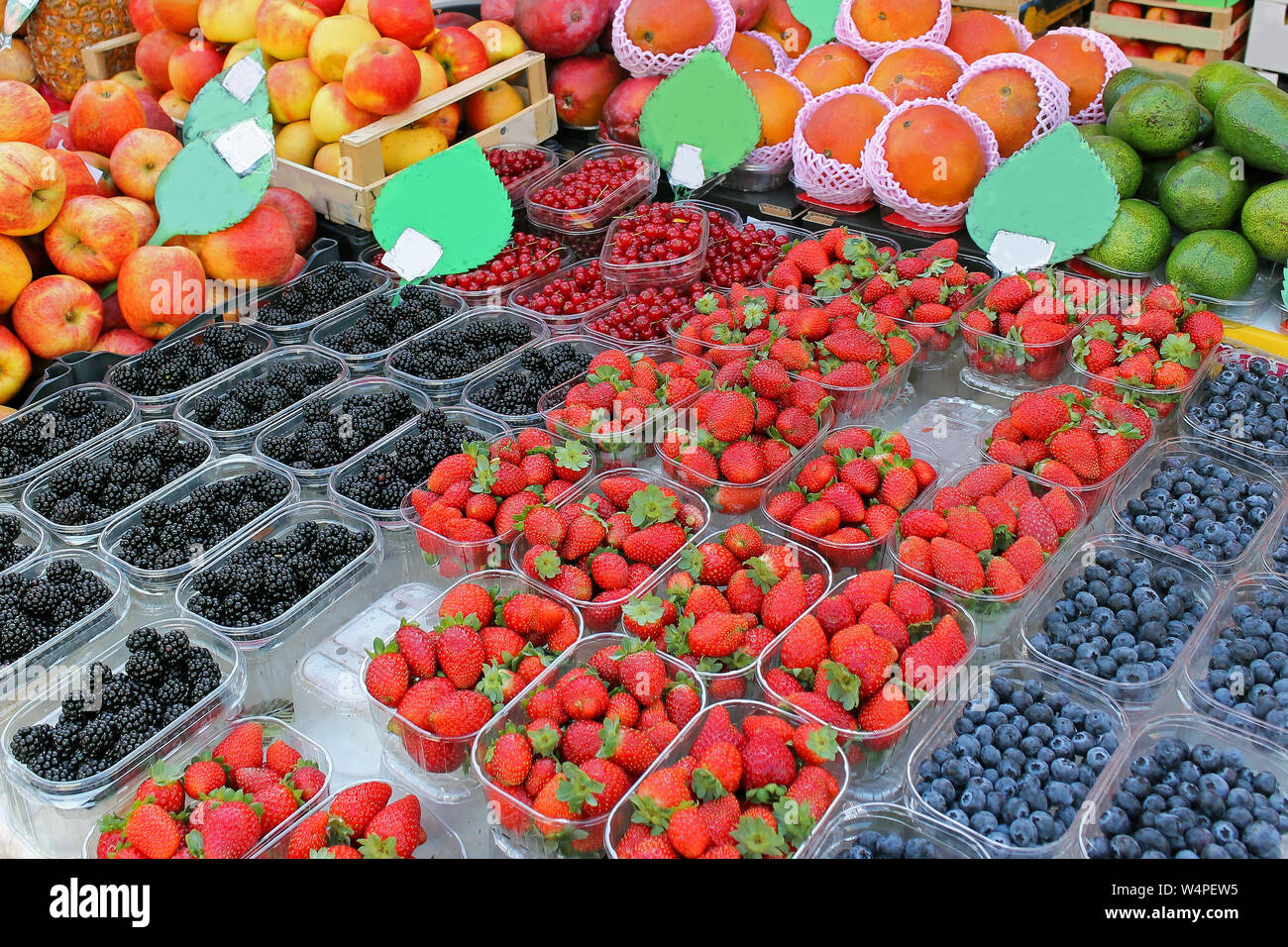 Fresh organic fruits pile sold on market stall Stock Photo - Alamy